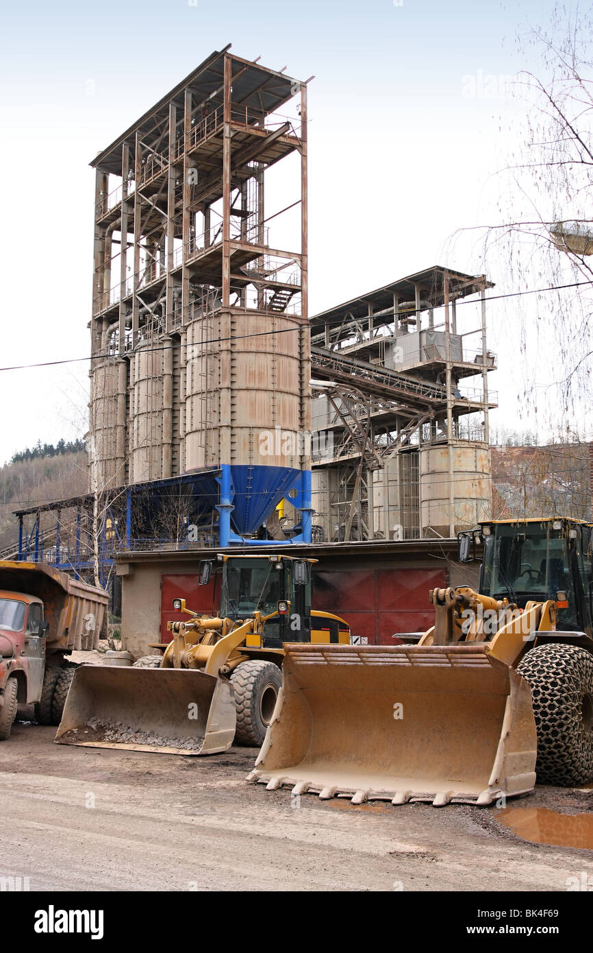 Stone quarry with silos, conveyor belts and piles of stones Stock Photo ...