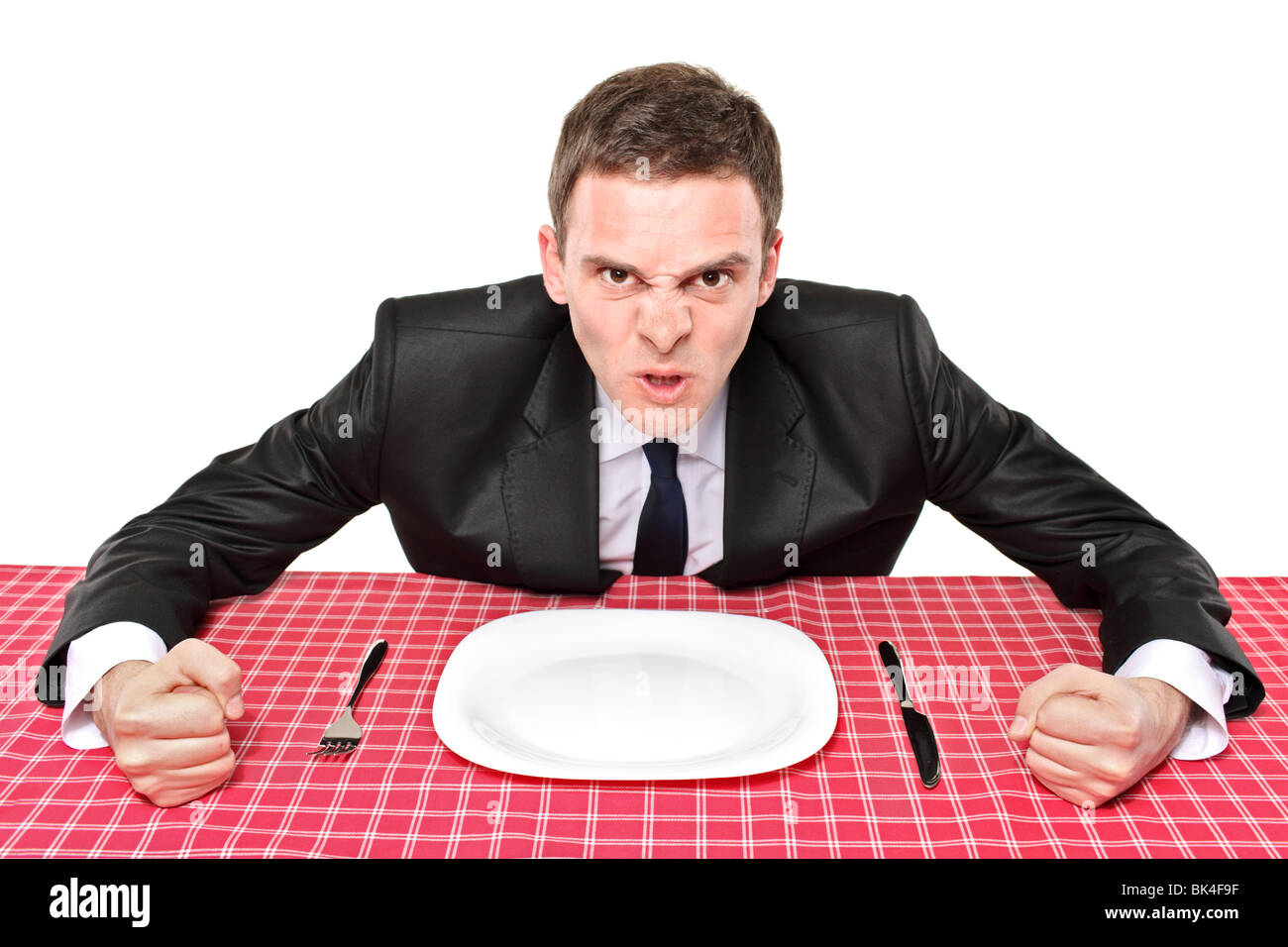 An angry man waiting his food in a restaurant Stock Photo - Alamy