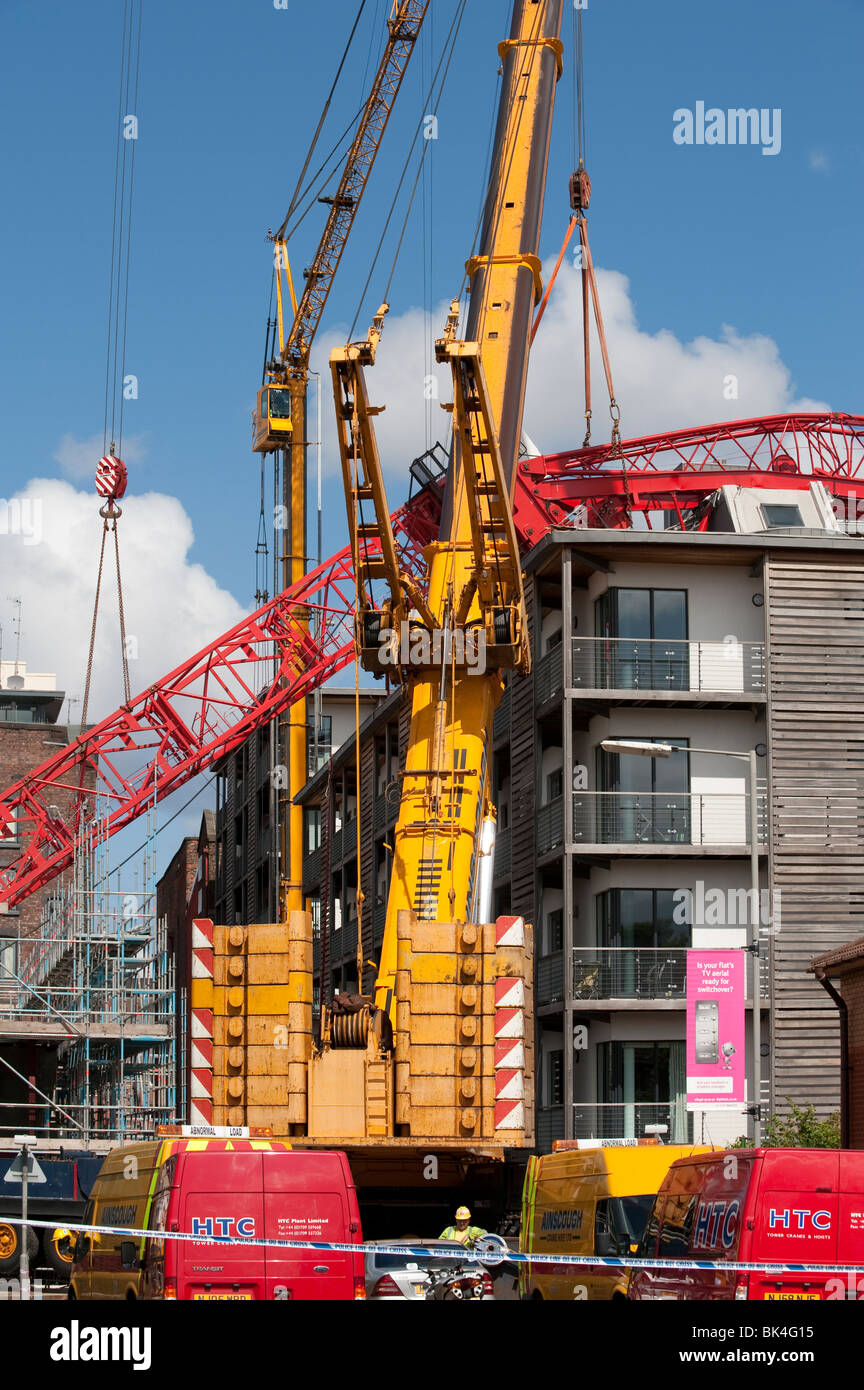 Tower crane collapsed fallen onto roof of apartment block being lifted ...