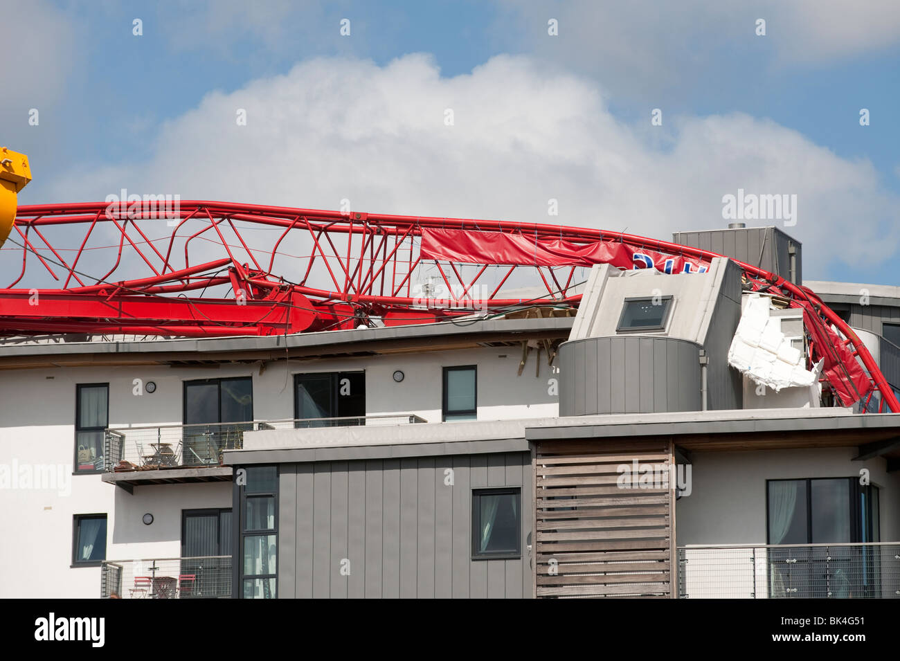 Tower crane collapsed fallen onto roof of apartment block being lifted ...