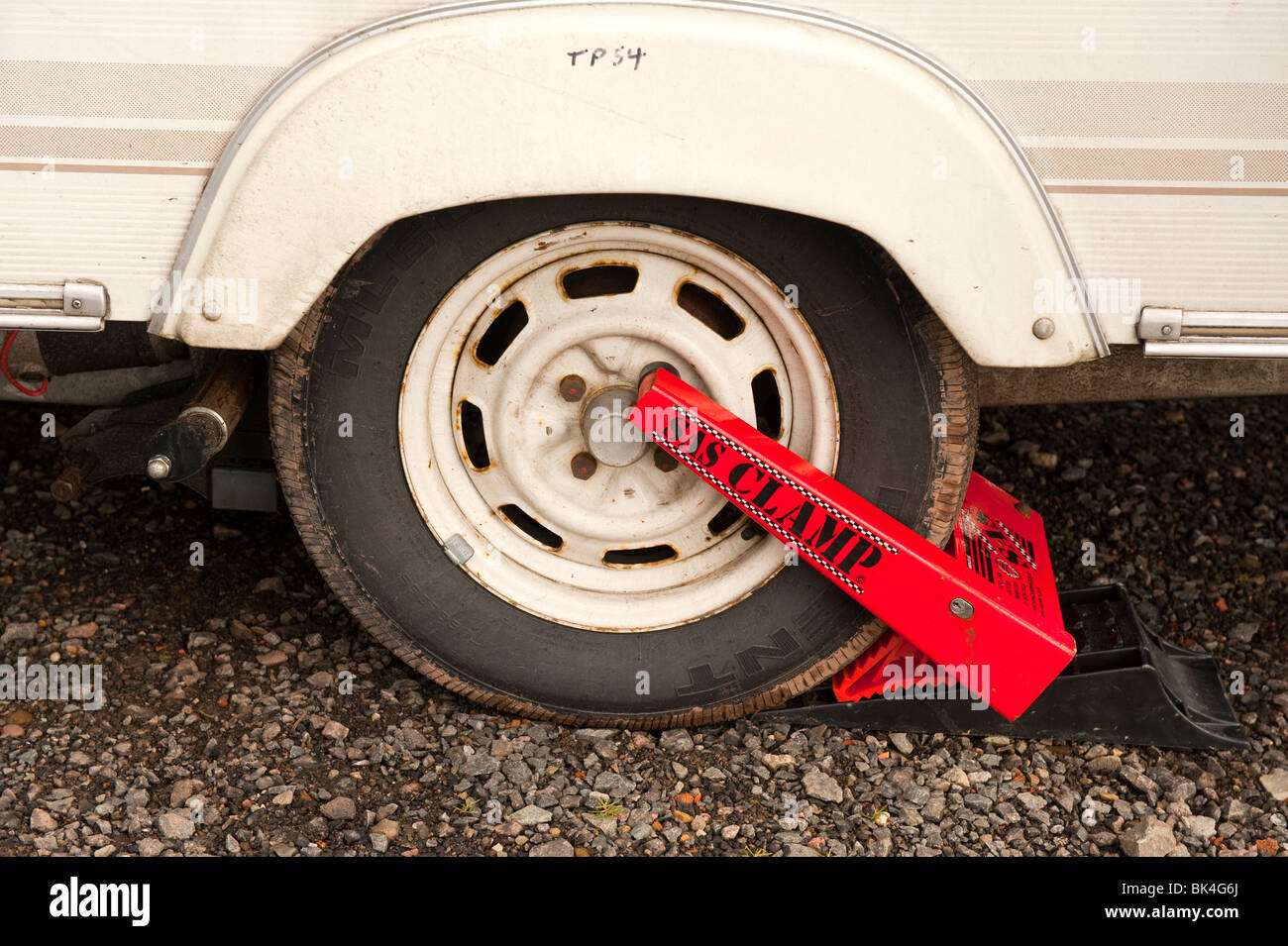 SAS Security wheel clamp on caravan wheel Stock Photo - Alamy