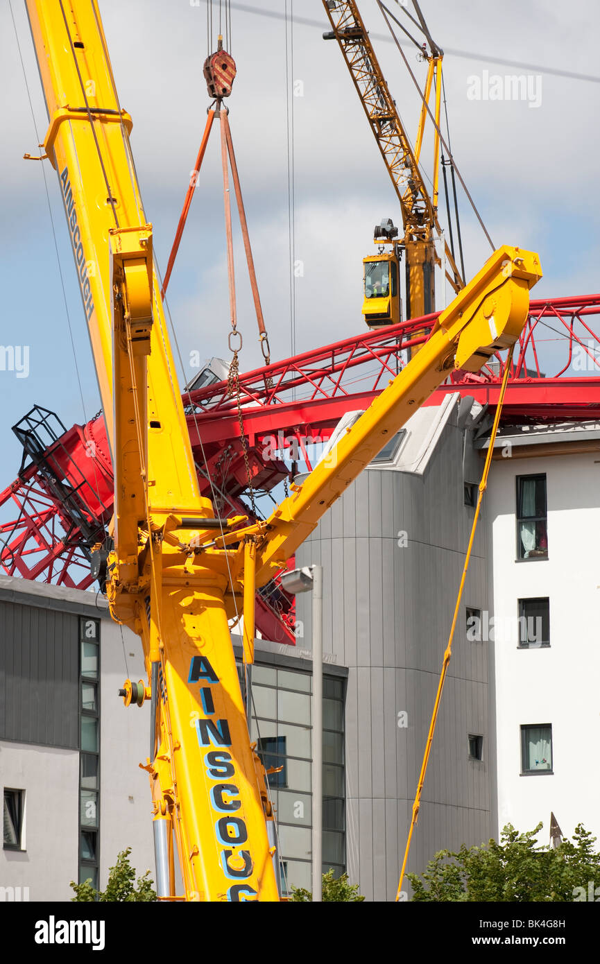 Tower crane collapsed fallen onto roof of apartment block being lifted ...