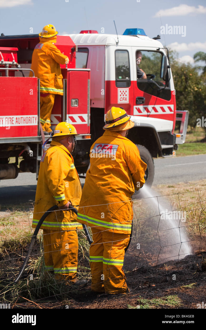 CFA fire fighters tackle a roadside fire near Shepperton, Victoria ...