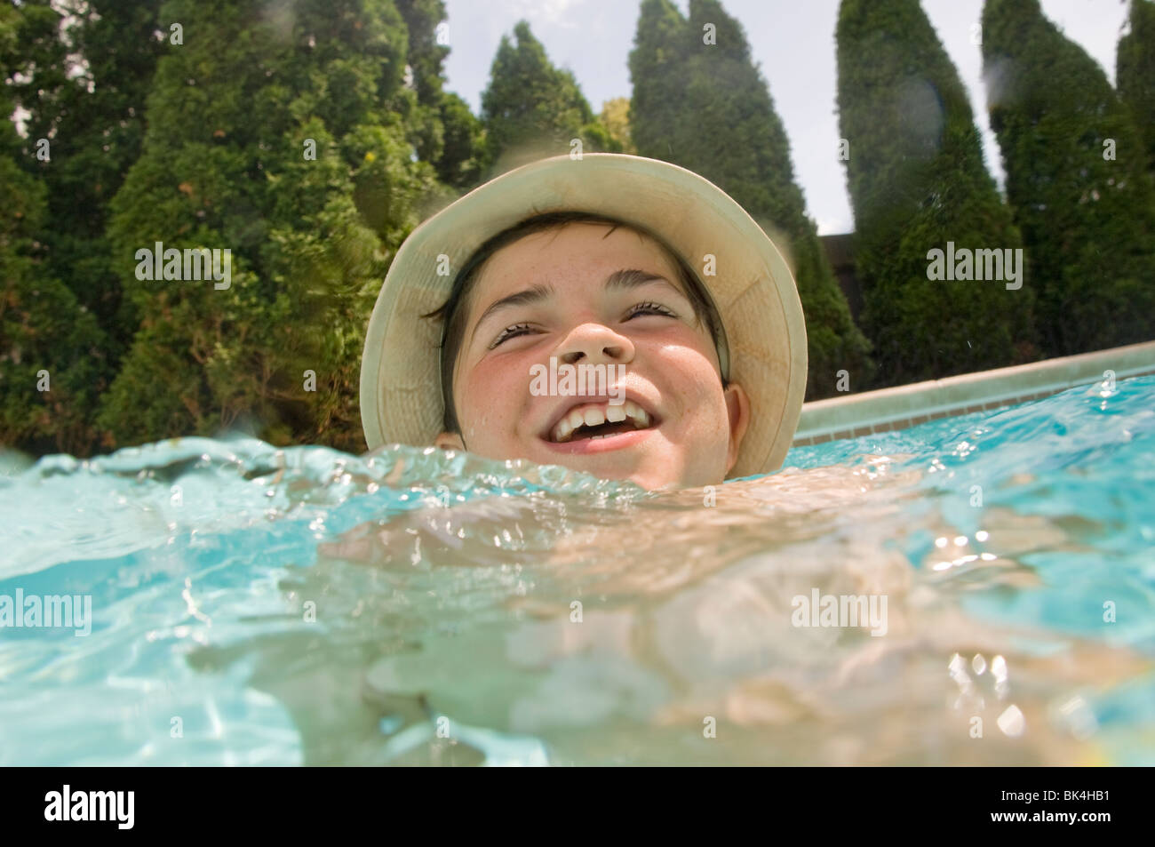 Boy swimming in outdoor pool hi-res stock photography and images - Alamy