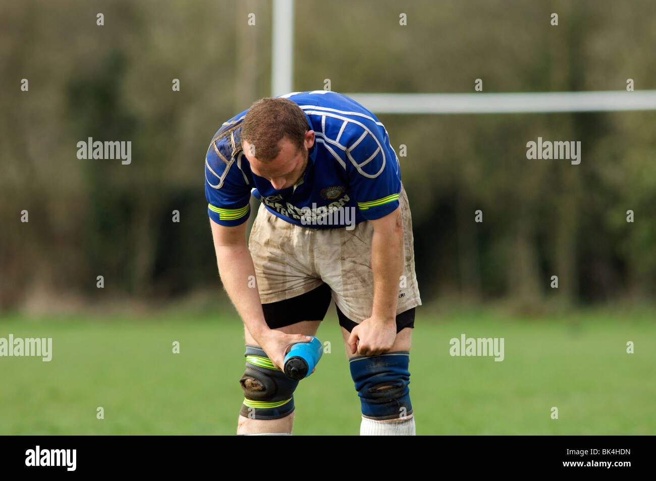 rugby player bends over exhausted Stock Photo - Alamy