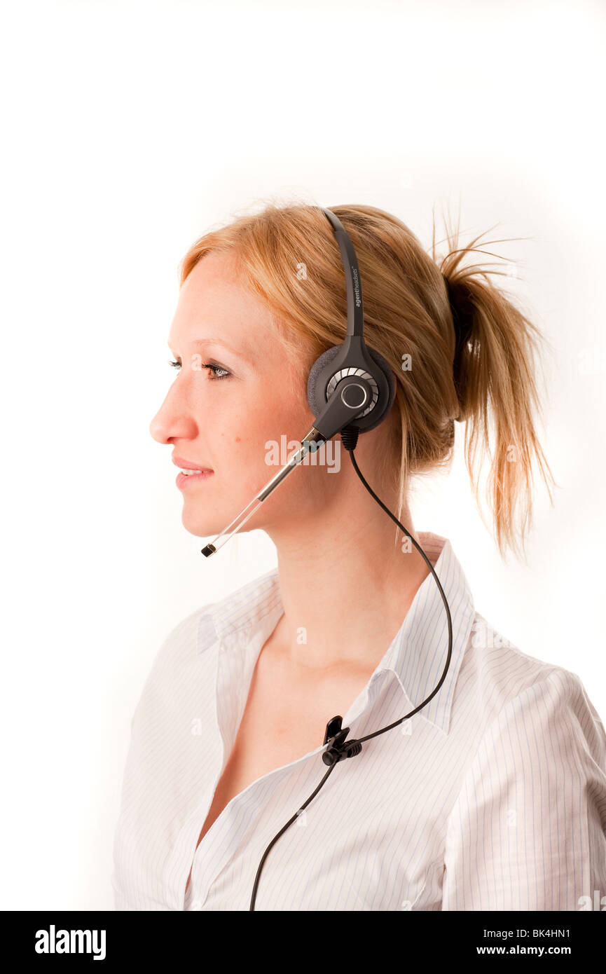 Blonde female Customer Services Telesales person wearing a telephone ...