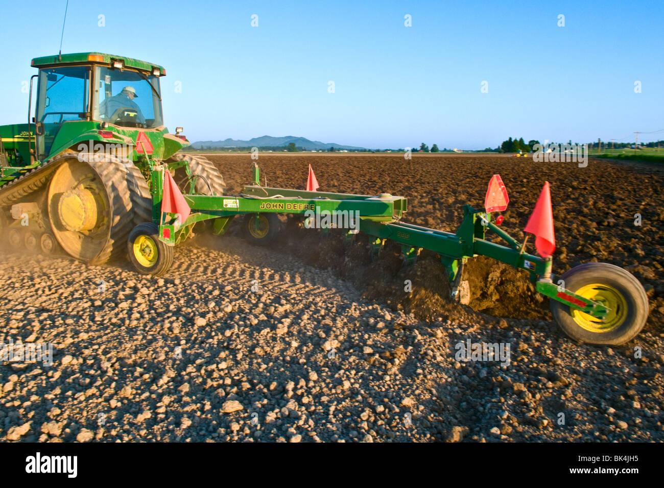 John Deere Tractor Plowing Field