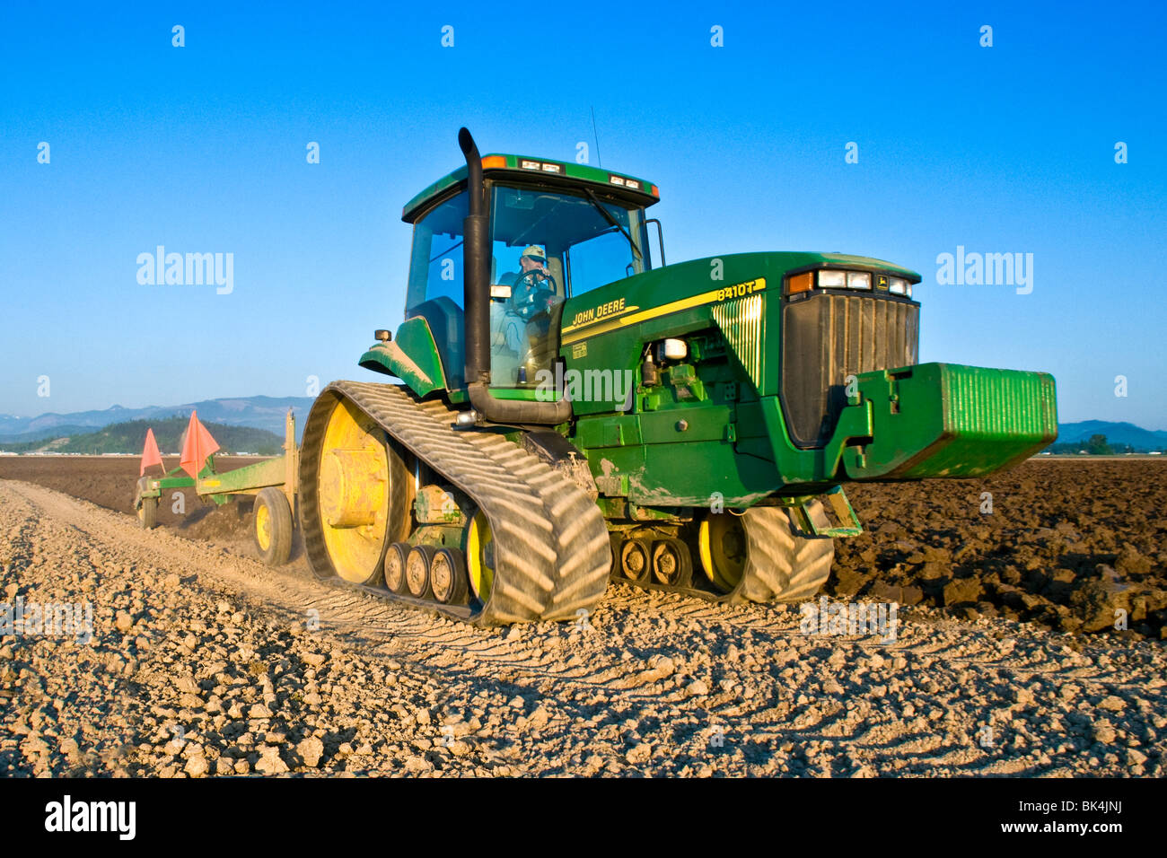 John Deere Tractor Plowing Field