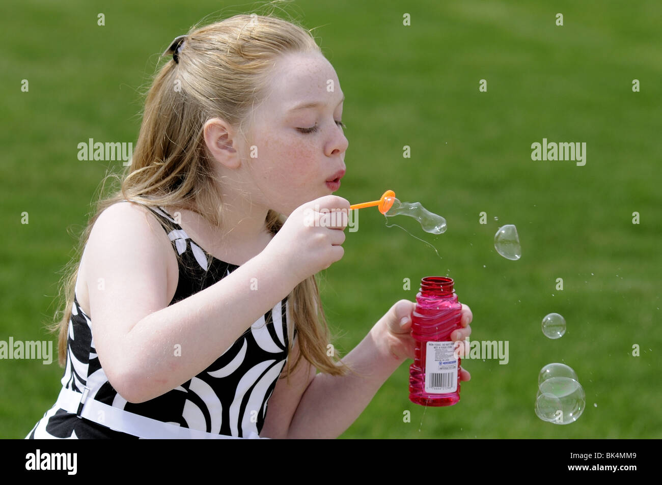 Children blowing bubbles Stock Photo - Alamy