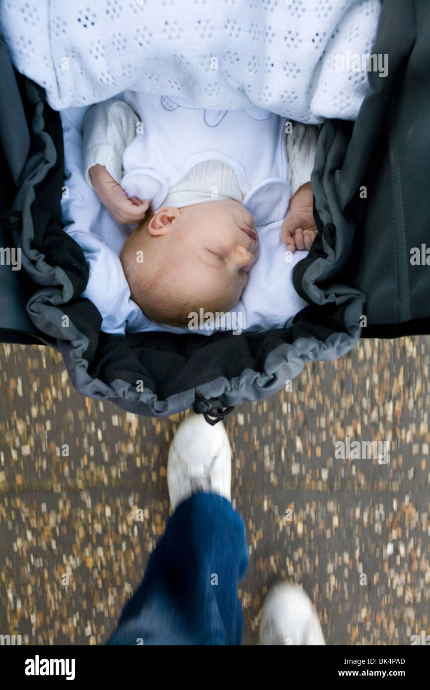 Pushing child in push chair hi-res stock photography and images - Alamy