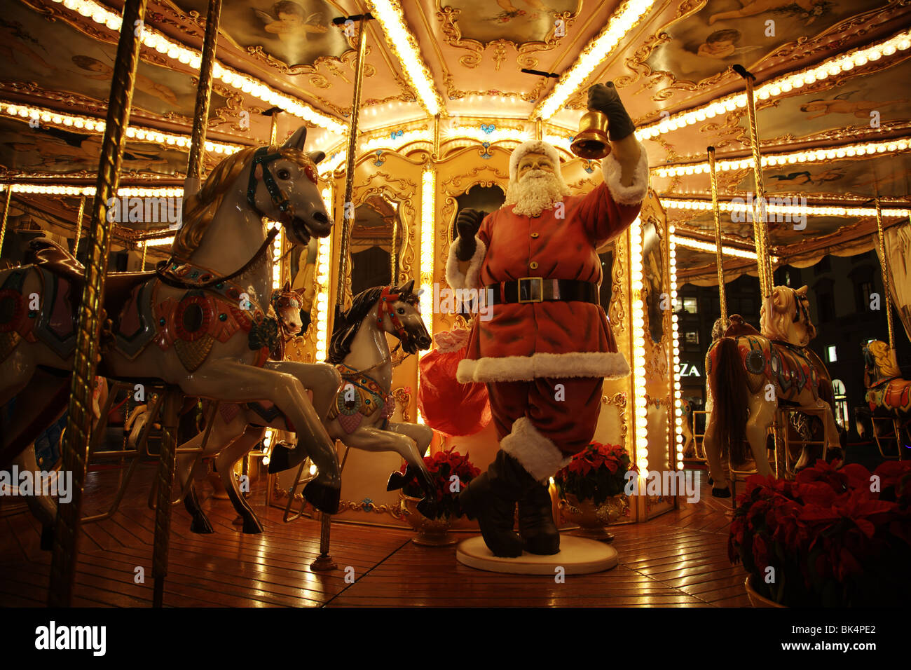 Santa in Merry Go Round before Christmas Stock Photo - Alamy