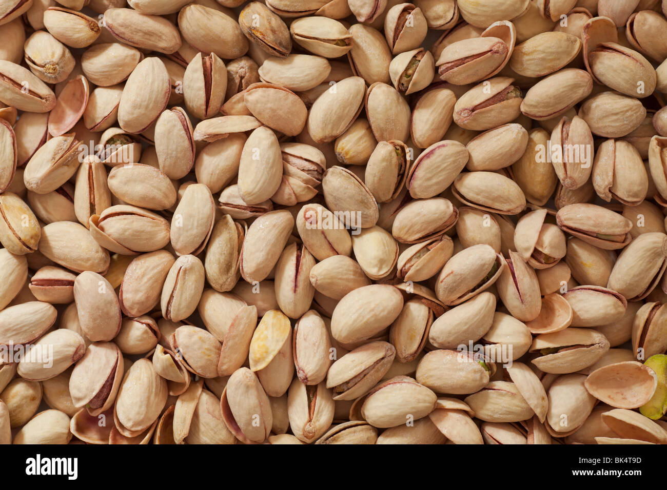 A pile of roasted pistachio nuts Stock Photo - Alamy