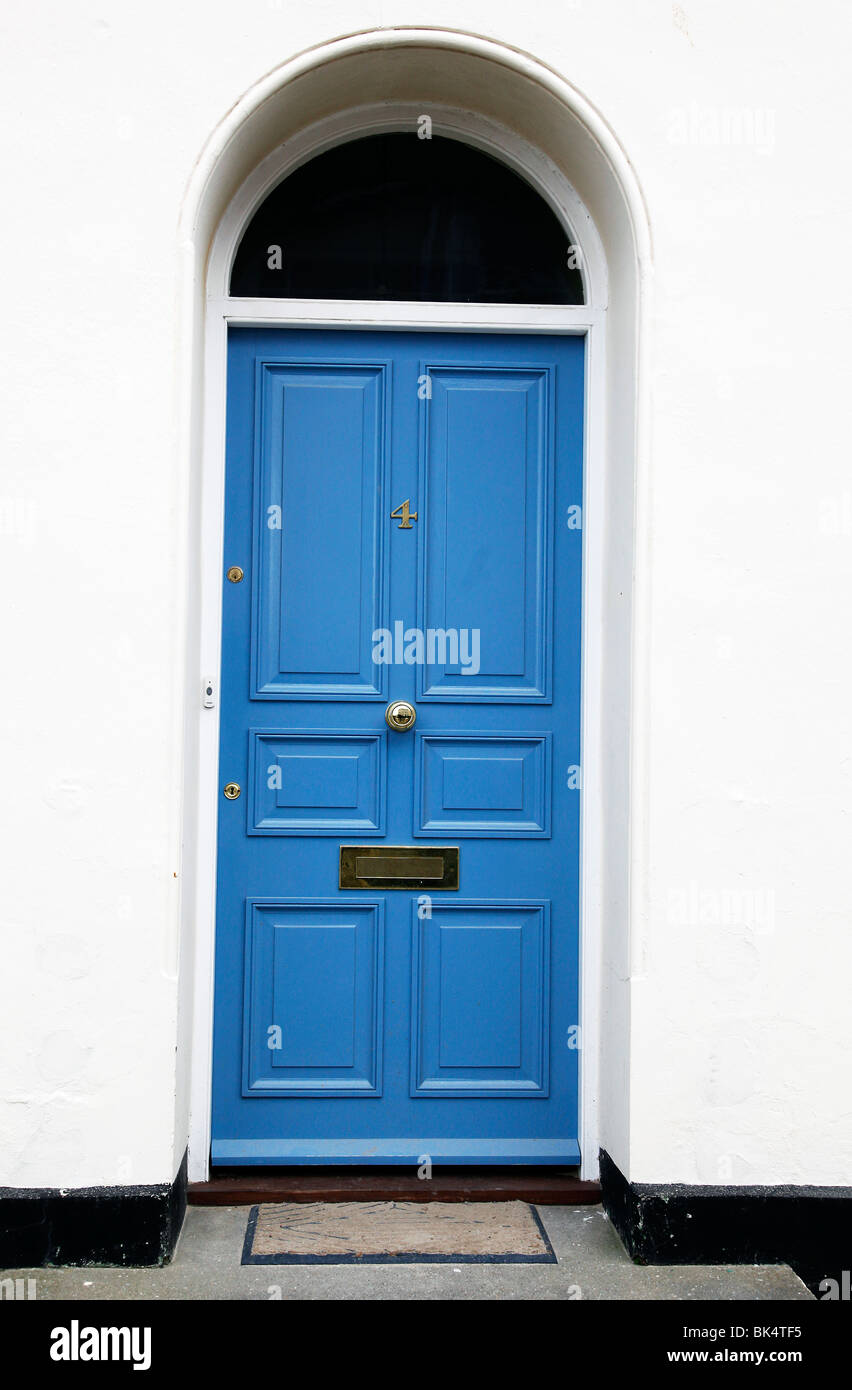 An elegant blue Georgian door with an arched window above Stock Photo ...