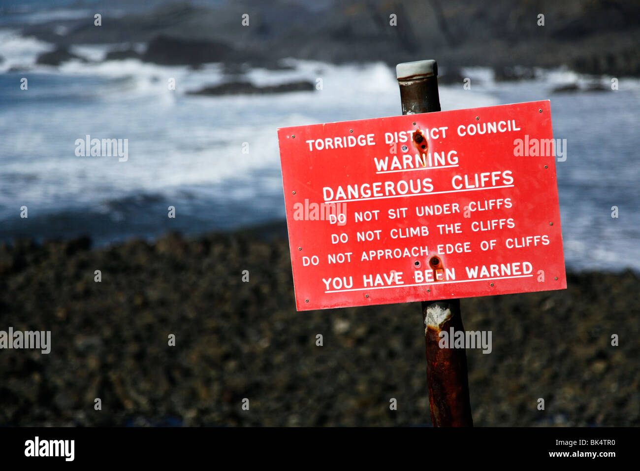 Danger Warning signs near a cliff edge Stock Photo - Alamy