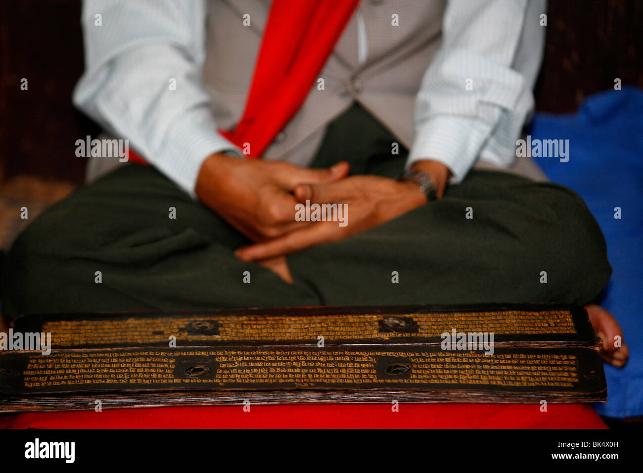 Man reading Buddhist scriptures, Golden temple, Patan, Nepal, Asia ...