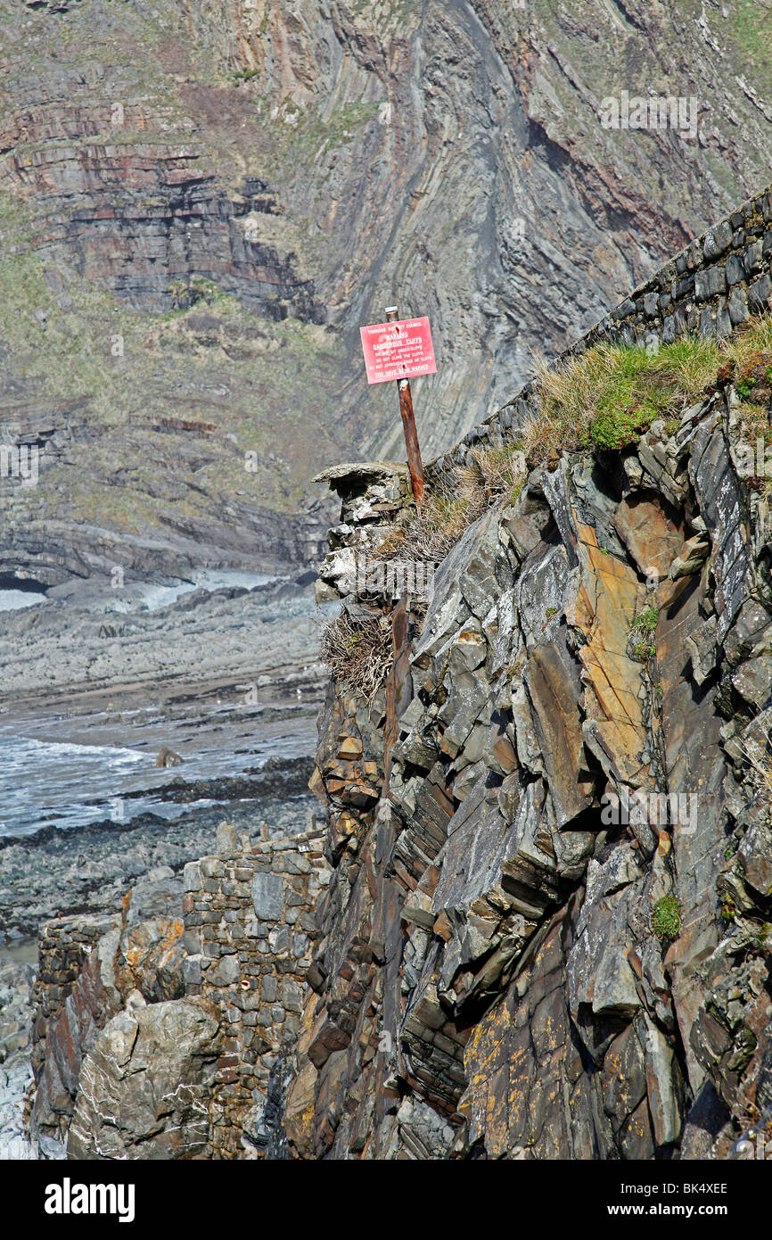 Danger Warning signs near a cliff edge Stock Photo - Alamy