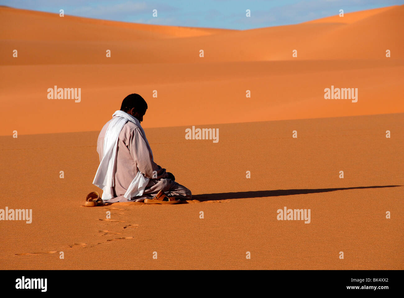 Muslim man praying in the desert, Sebha, Ubari, Libya, North Africa ...