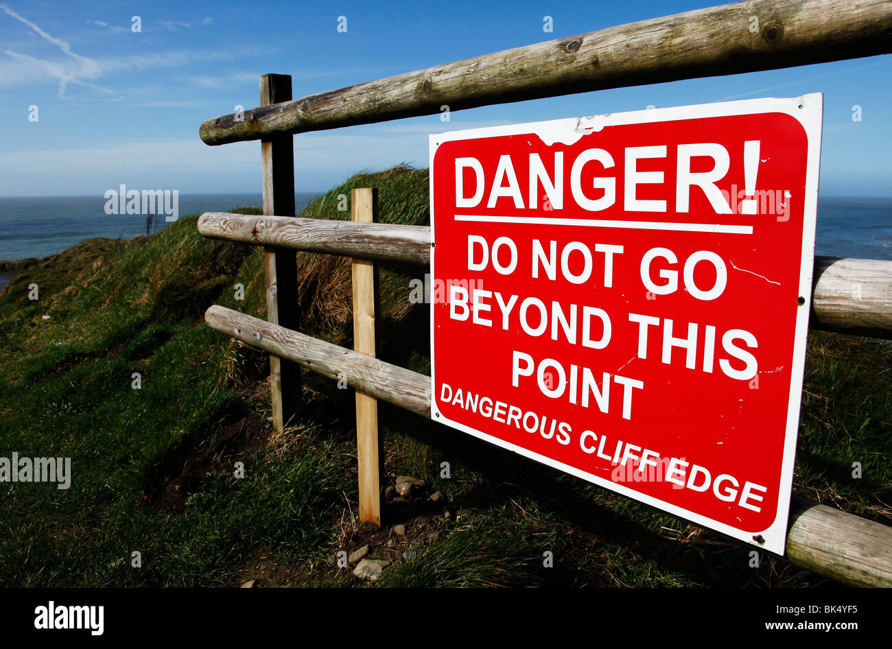 Danger Warning signs near a cliff edge Stock Photo - Alamy