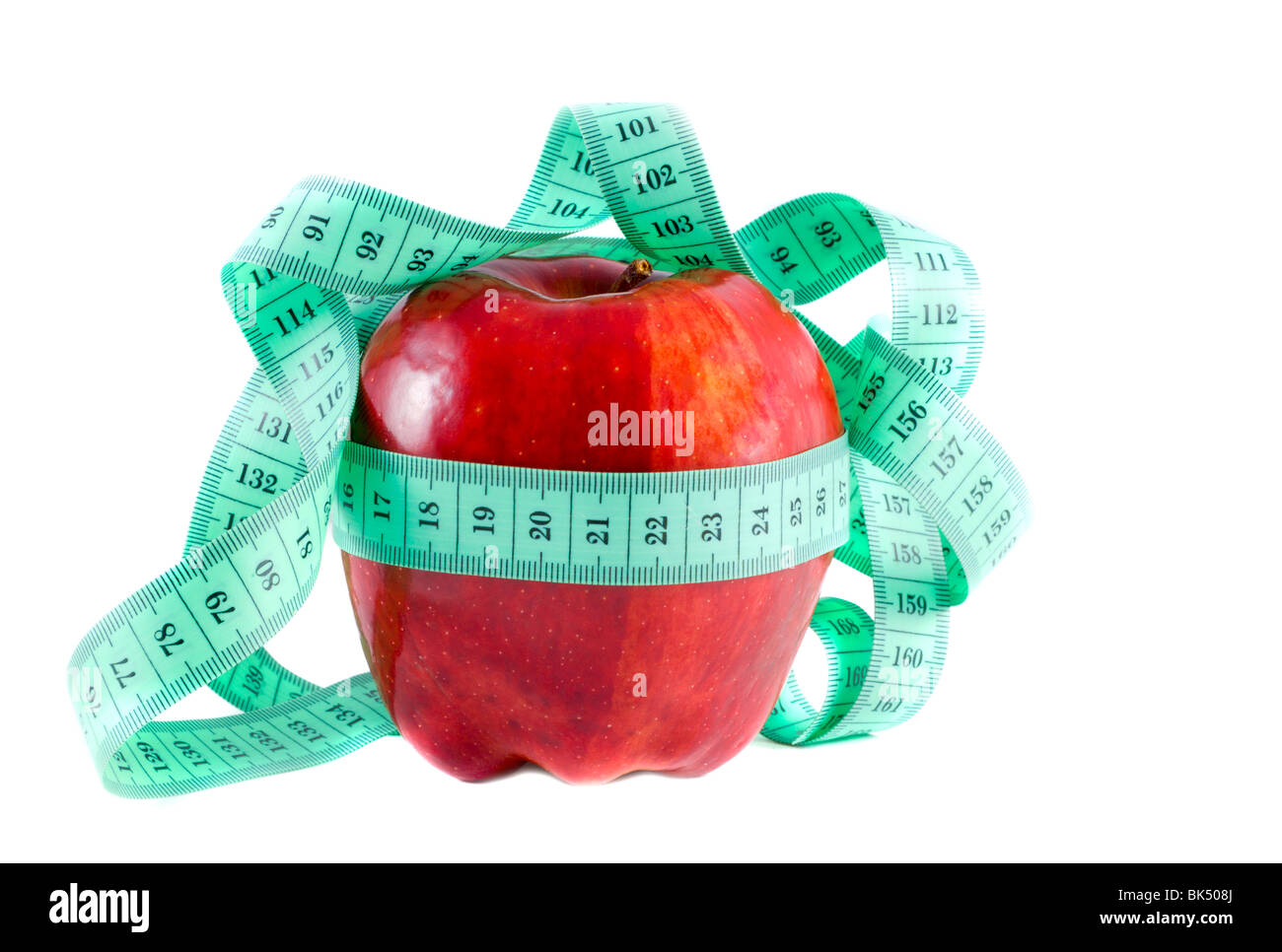 Apple with a measuring tape. Isolation on white Stock Photo - Alamy