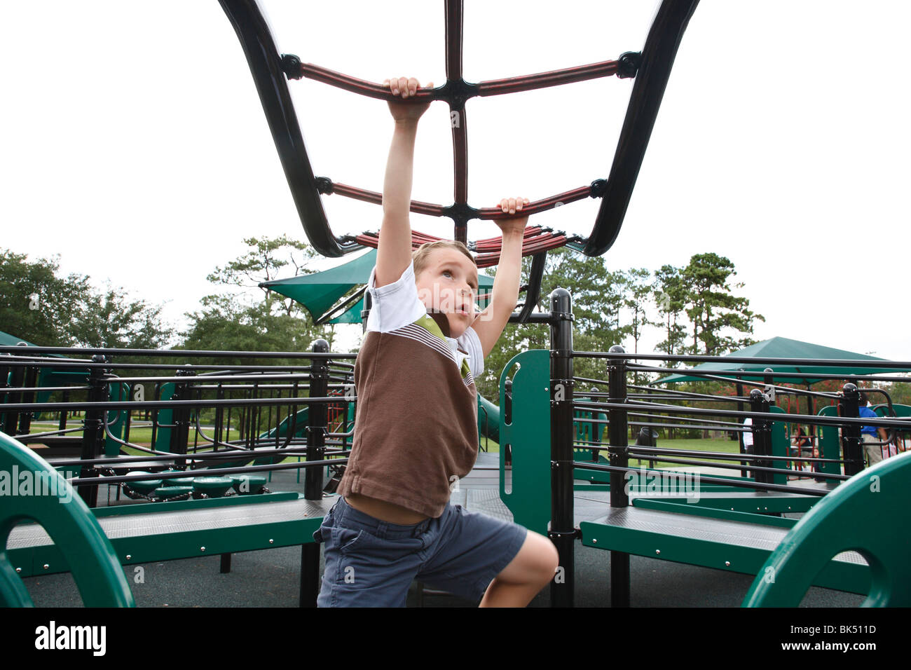 Boy swing monkey bar hi-res stock photography and images - Alamy
