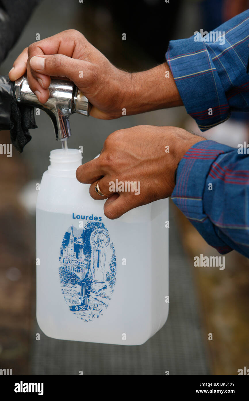 Holy water tap at the Lourdes shrine, Lourdes, Hautes Pyrenees, France ...