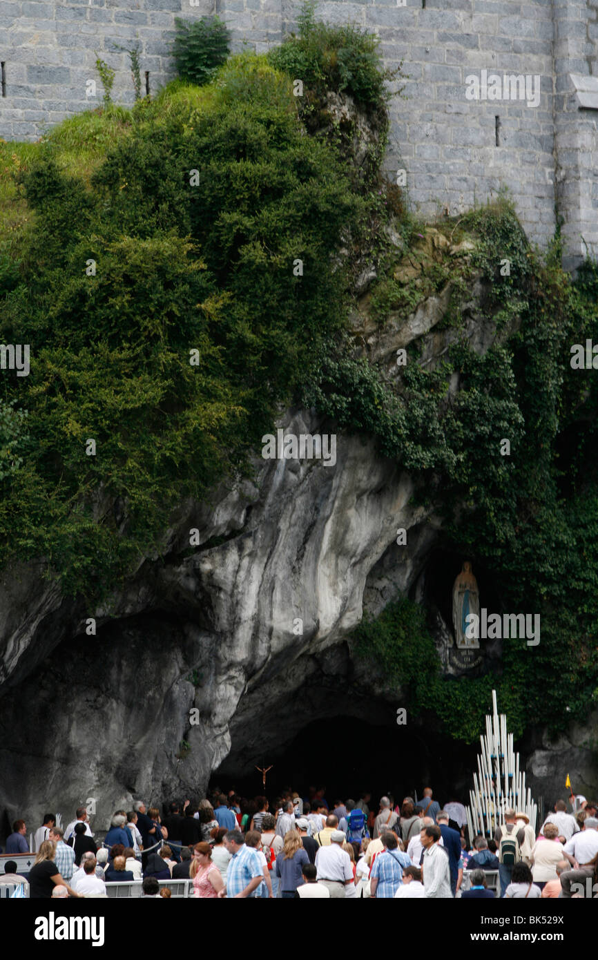 Pilgrims outside the Lourdes grotto, Lourdes, Hautes Pyrenees, France ...