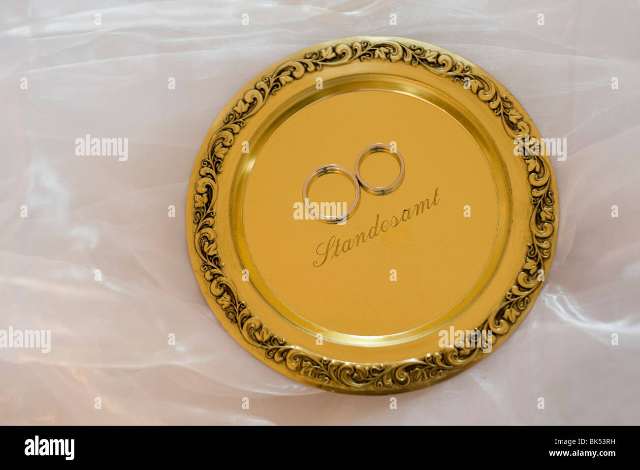 Gold Plate and Wedding Rings Stock Photo - Alamy
