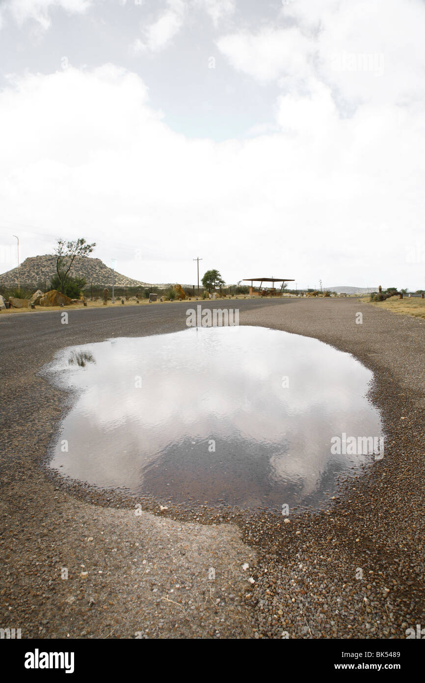 Puddle on road hi-res stock photography and images - Alamy