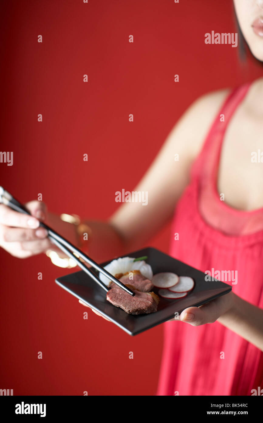 Woman Eating Chinese Appetizer Stock Photo - Alamy
