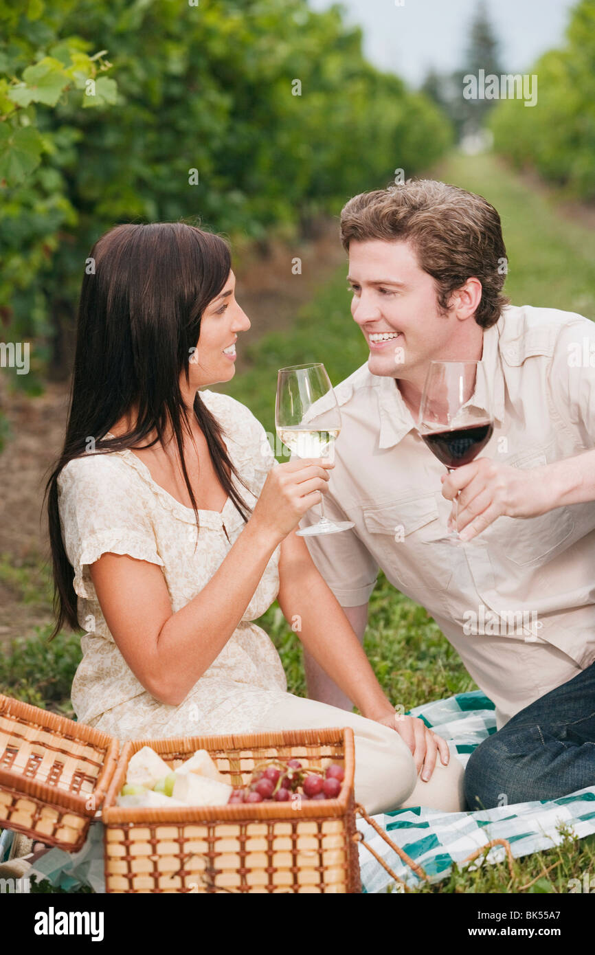 Couple Having a Picnic in a Vineyard Stock Photo - Alamy