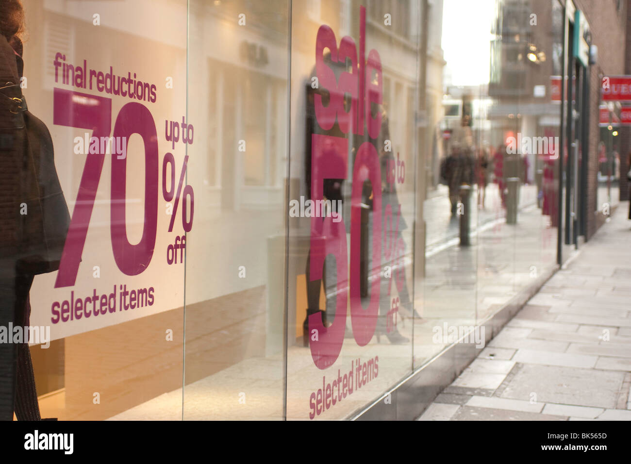 Sale signage in a high street shop window Stock Photo - Alamy