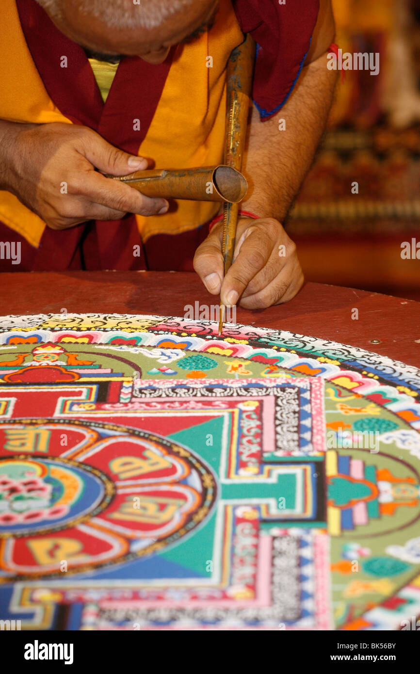 Buddhist monk drawing a mandala, Paris, Ile de France, France, Europe ...