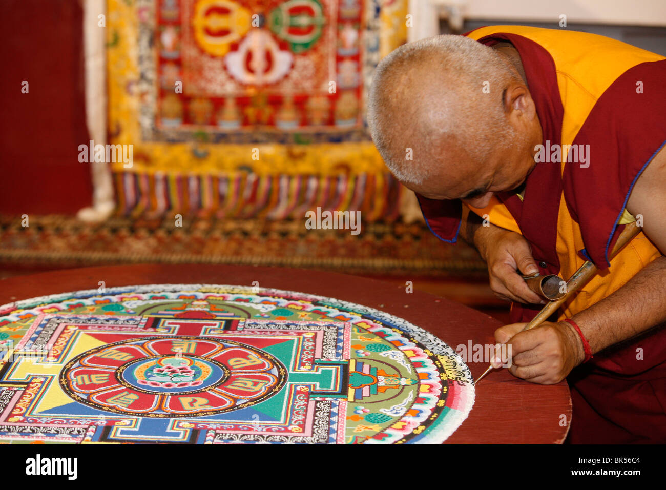Buddhist monk drawing a mandala, Paris, Ile de France, France, Europe ...