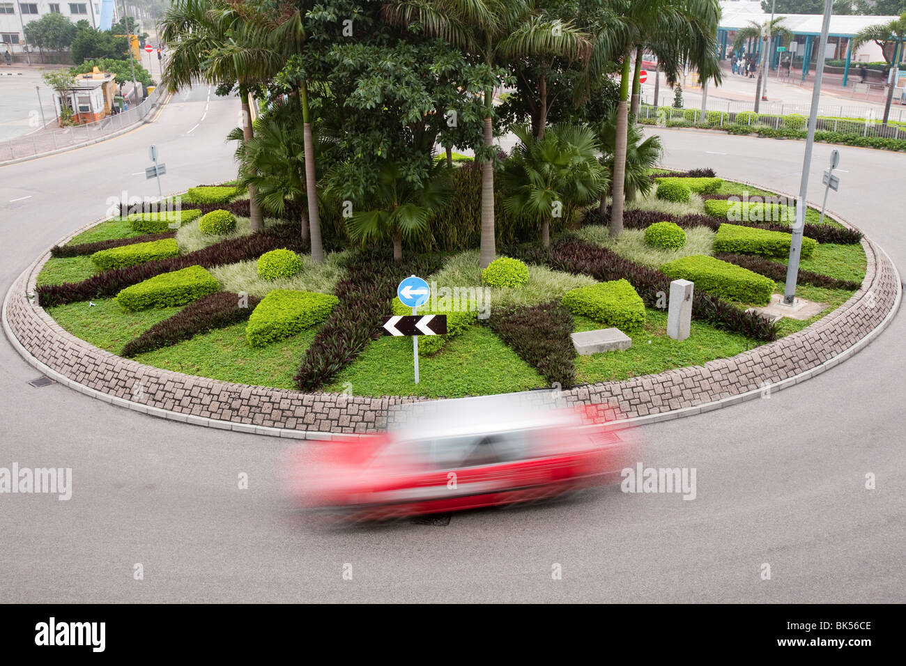 Taxi going round a roundabout in Hong Kong, China Stock Photo - Alamy