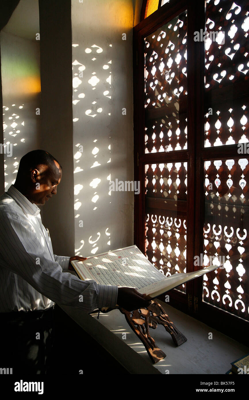 Man reading the Koran in a Doha mosque, Doha, Qatar, Middle East Stock ...
