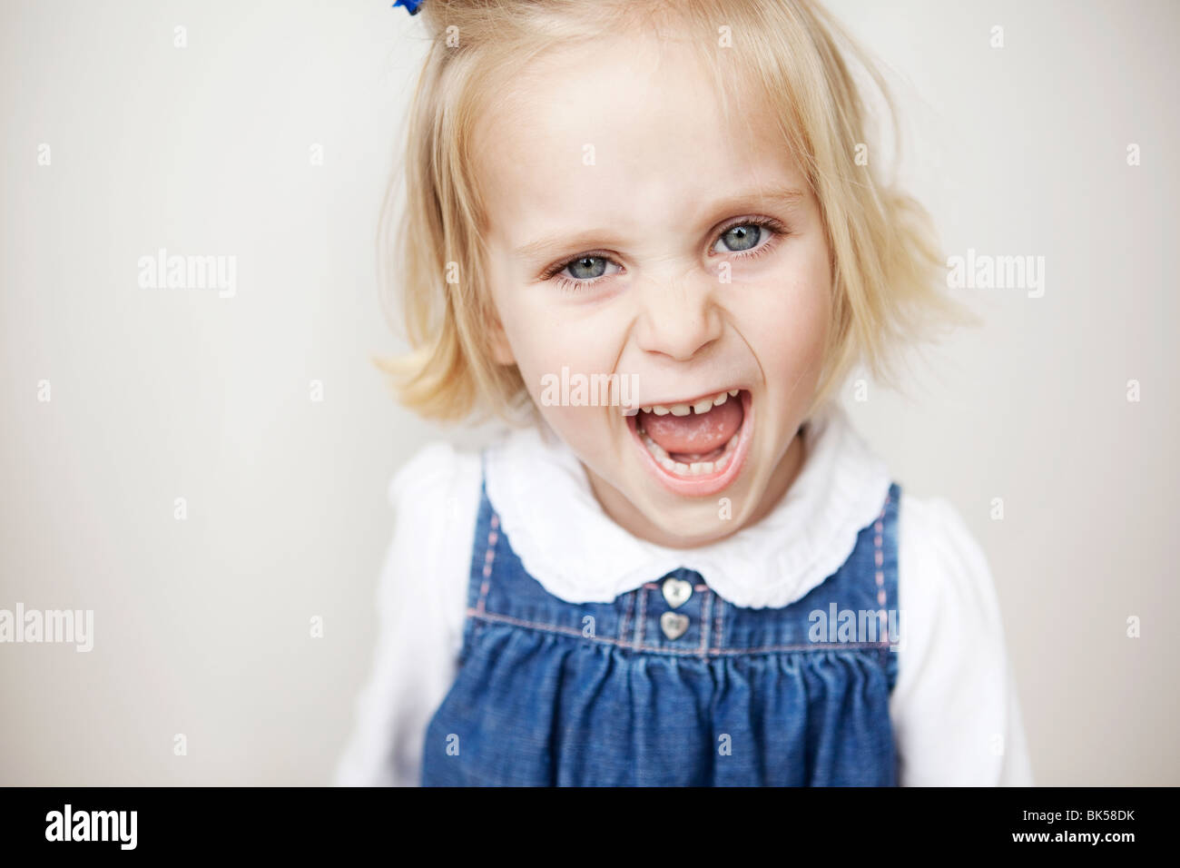 Young girl yelling Stock Photo - Alamy