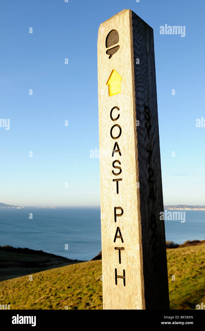 Wooden post coastal path marker sign Stock Photo - Alamy