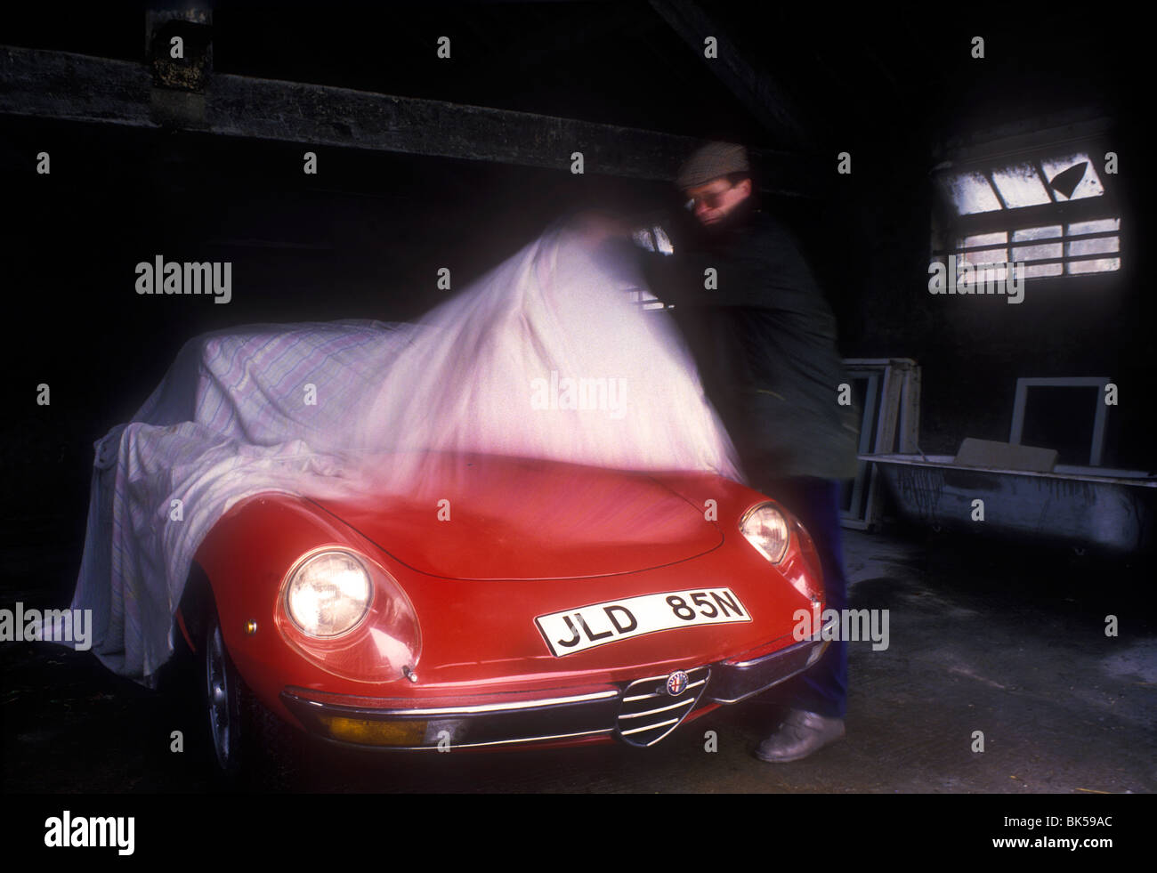 Classic car owner with his Alfa Romeo Spider 1974 Stock Photo - Alamy