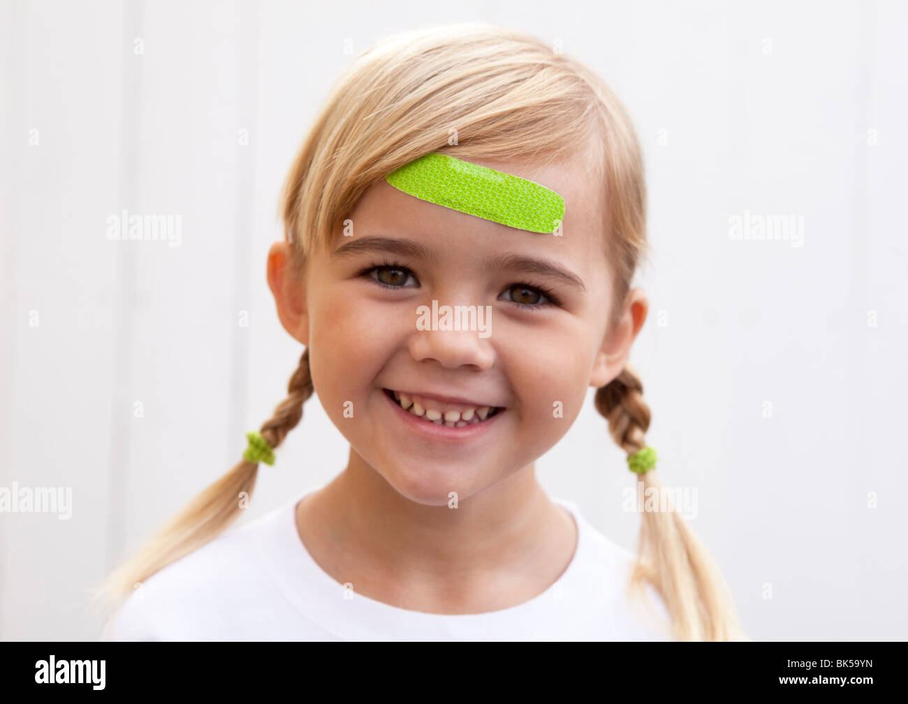 Little girl with band aid on forehead Stock Photo Alamy
