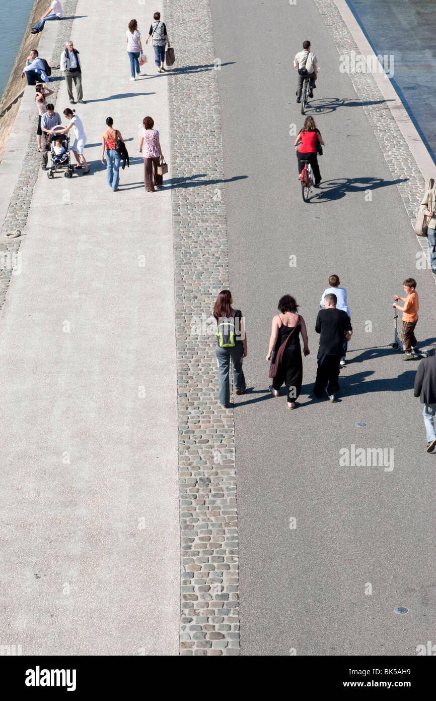 People walking on the river bank in Lyon France Stock Photo - Alamy