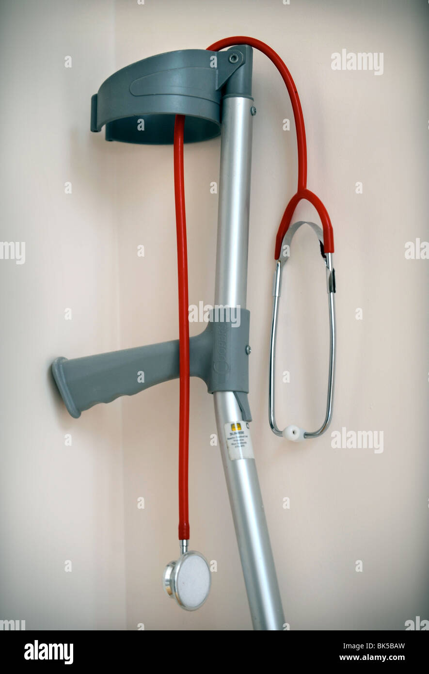 A hospital walking crutch and a doctor's stethoscope Stock Photo - Alamy