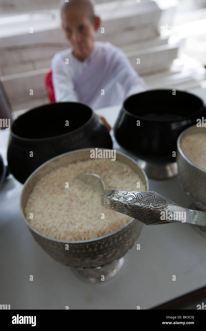 Buddhist rice offering hi-res stock photography and images - Alamy