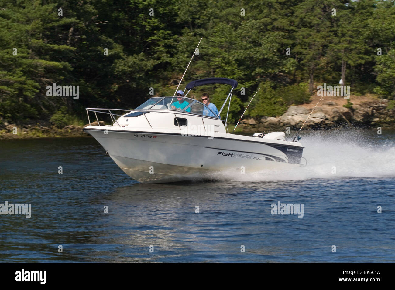 Speedy motorboat on a windy day on the Sasanoa River, Maine Stock Photo ...