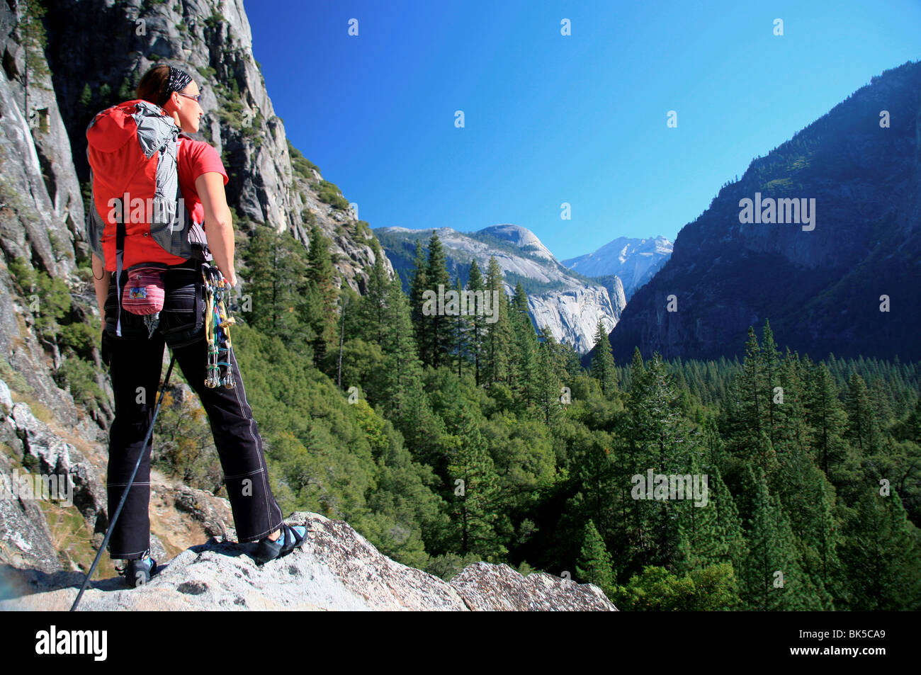A climber takes a break on the lower slopes of El Capitan, Yosemite ...