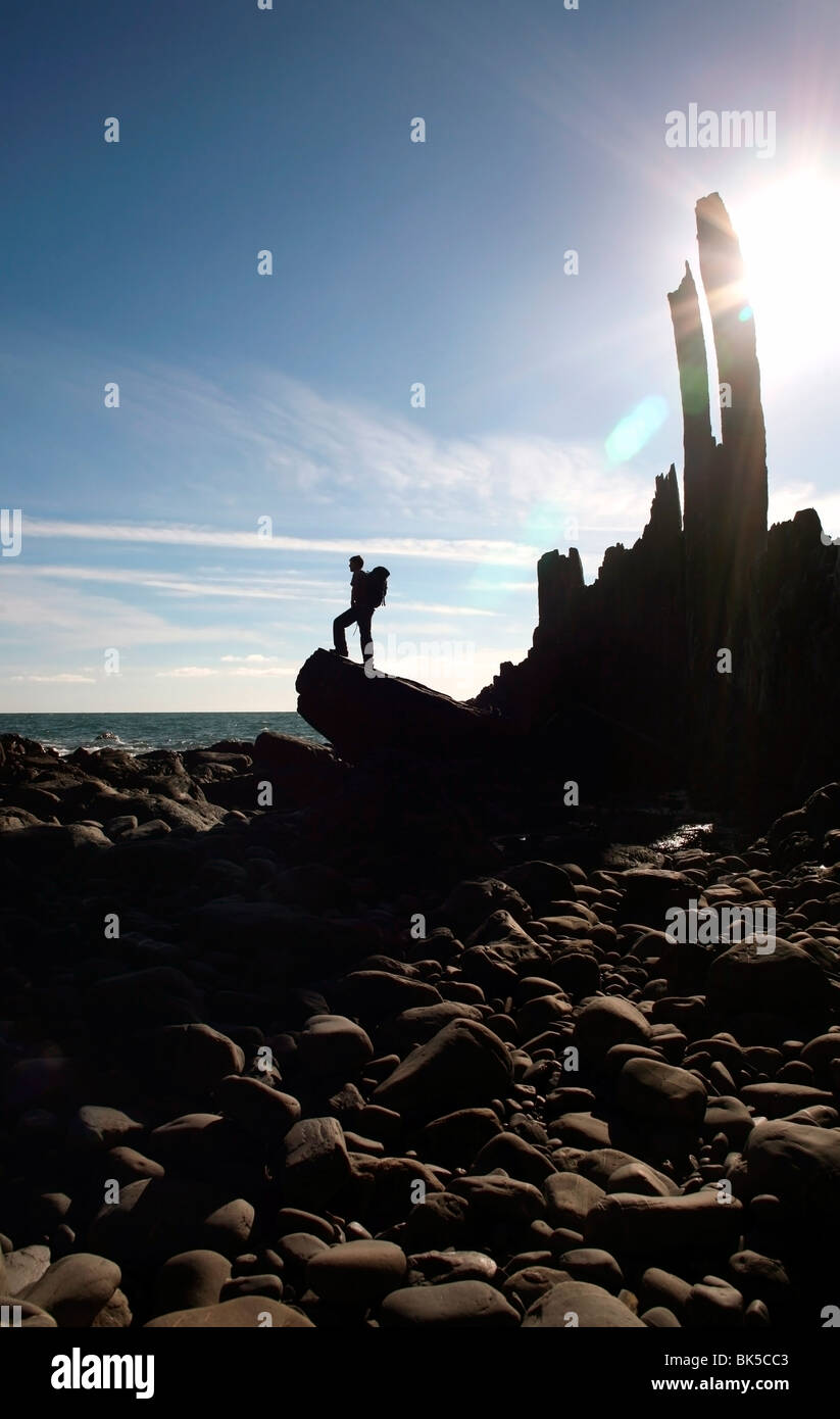 A walker stands on a boulder beside Bear Rock, a Culm pinnacle near ...