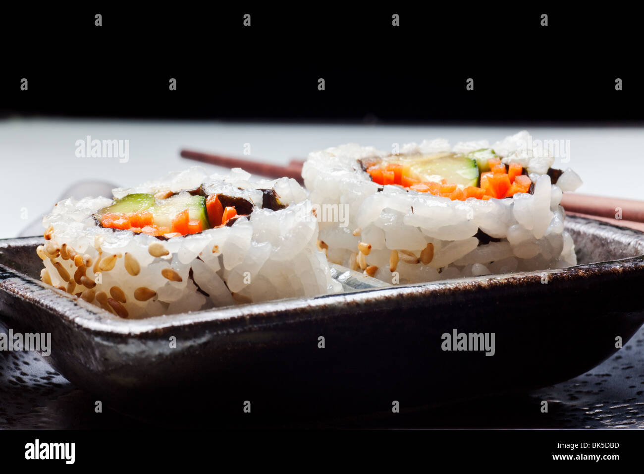 Vegetarian sushi California roll with rice and seaweed on Japanese ...