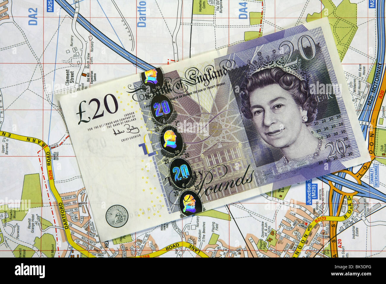 a £20 note on a the page of an open road map Stock Photo - Alamy