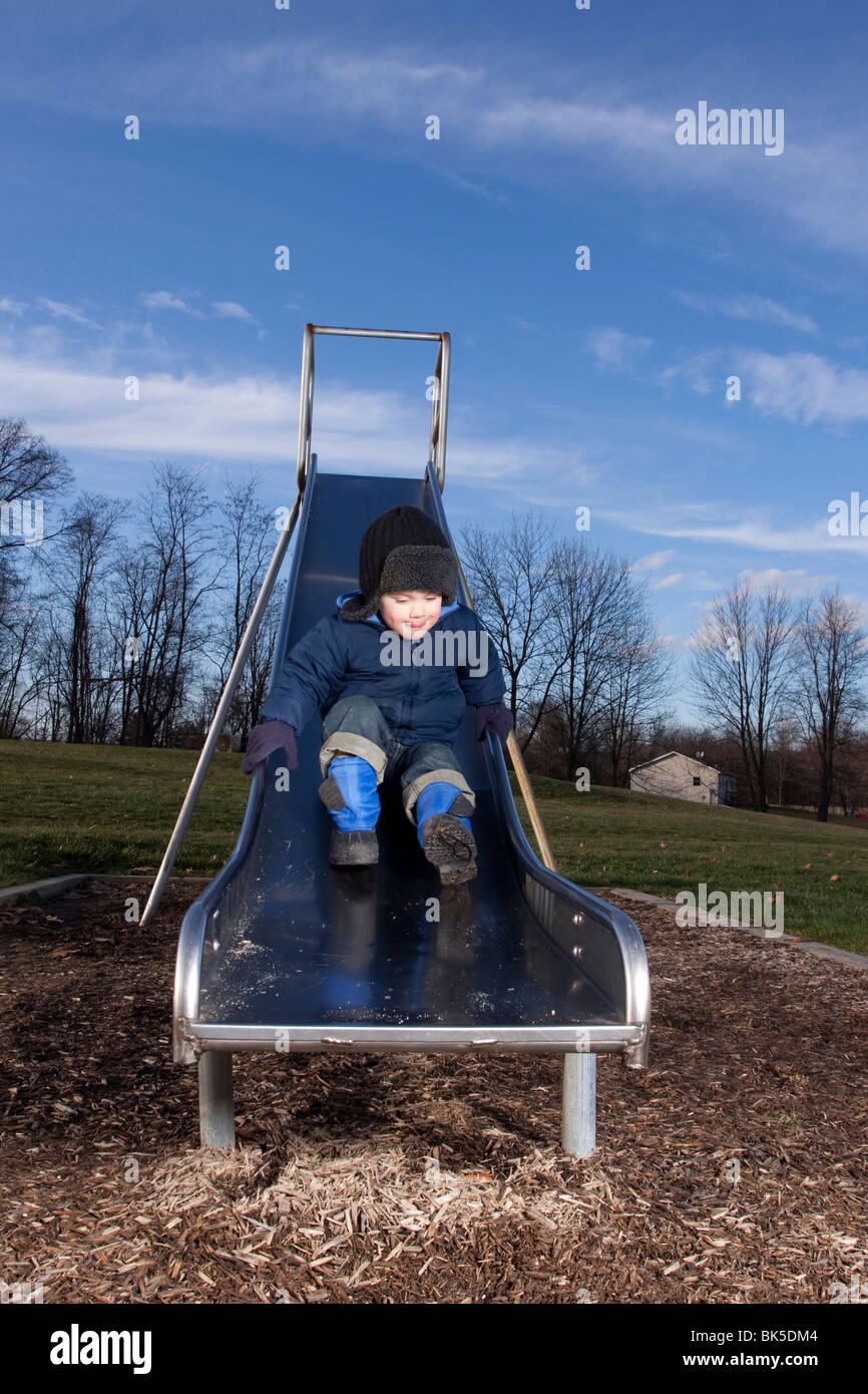 Boy child slide in hi-res stock photography and images - Alamy