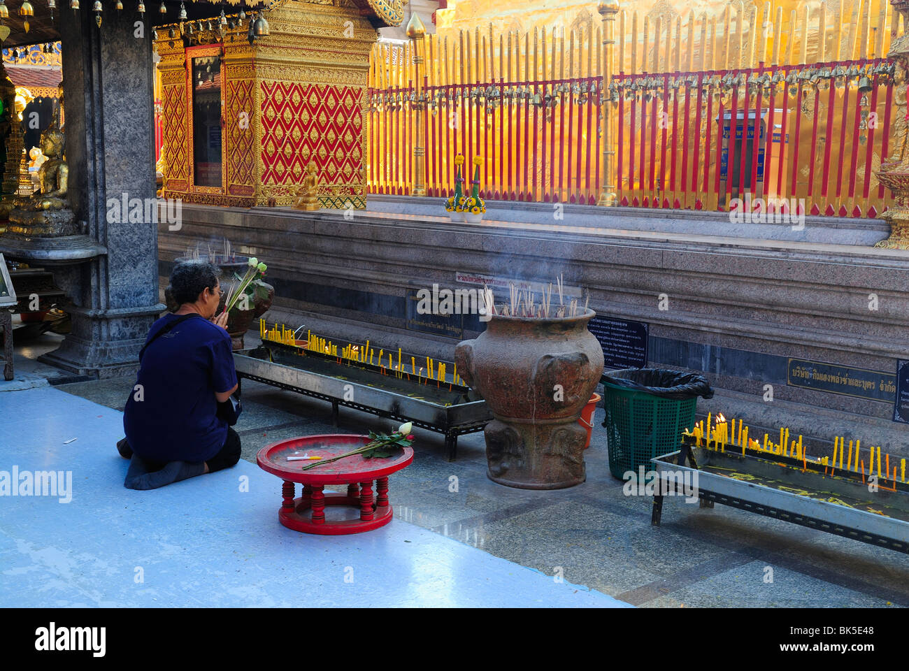 Woman praying in temple hi-res stock photography and images - Alamy