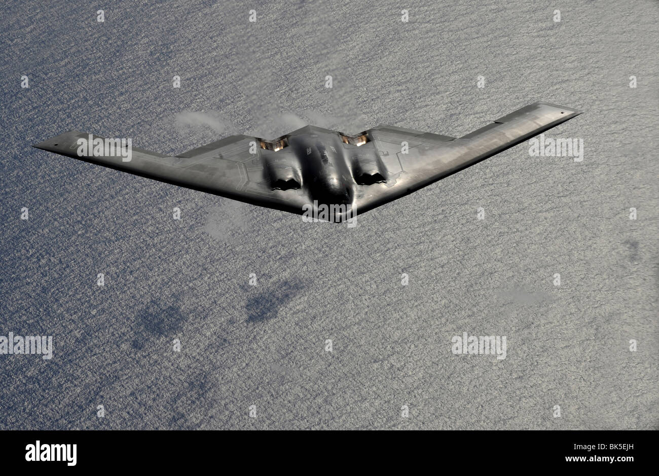 A B-2 Spirit flies over the Pacific Ocean during a mission exercise ...